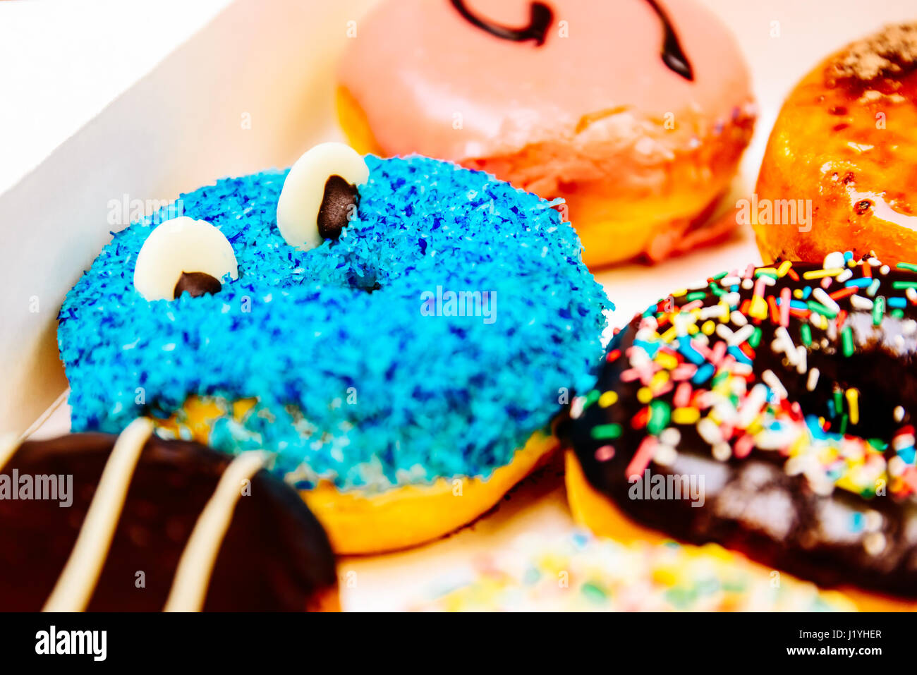 Funny Colorful Donuts In Box Stock Photo - Alamy