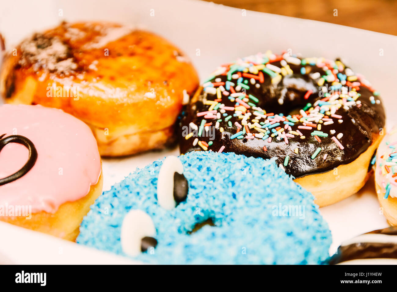 Funny Colorful Donuts In Box Stock Photo - Alamy