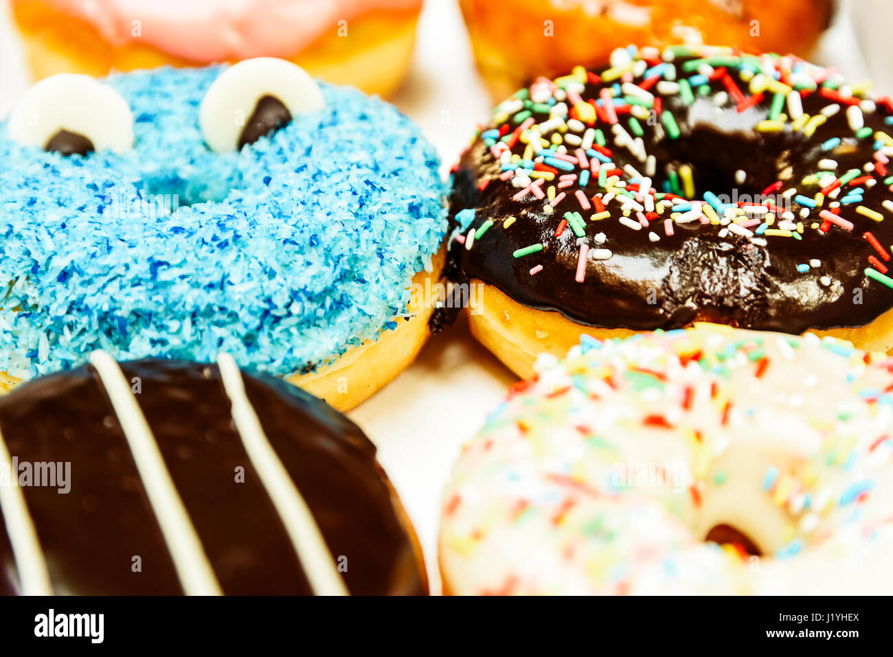 Funny Colorful Donuts In Box Stock Photo - Alamy