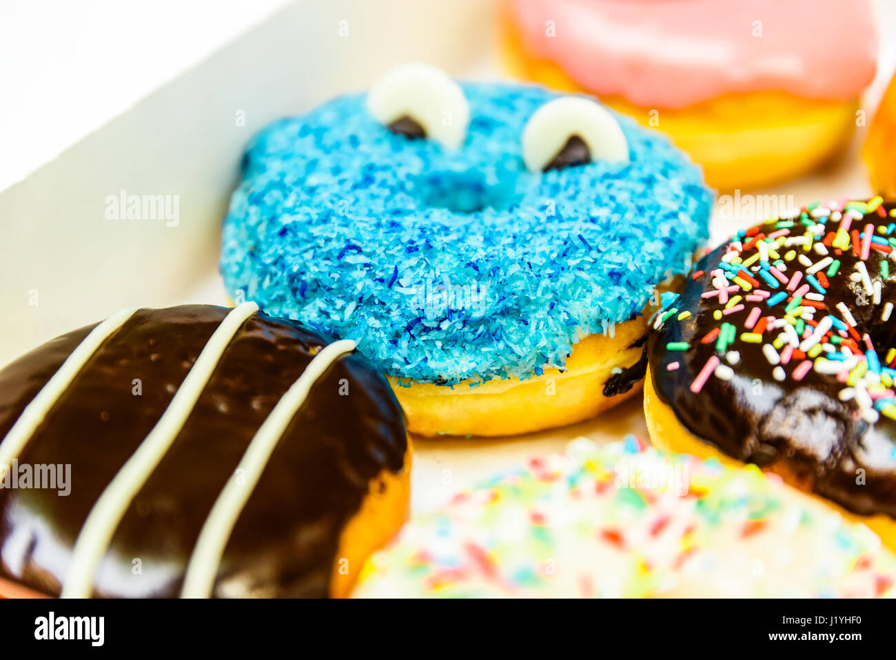 Funny Colorful Donuts In Box Stock Photo - Alamy