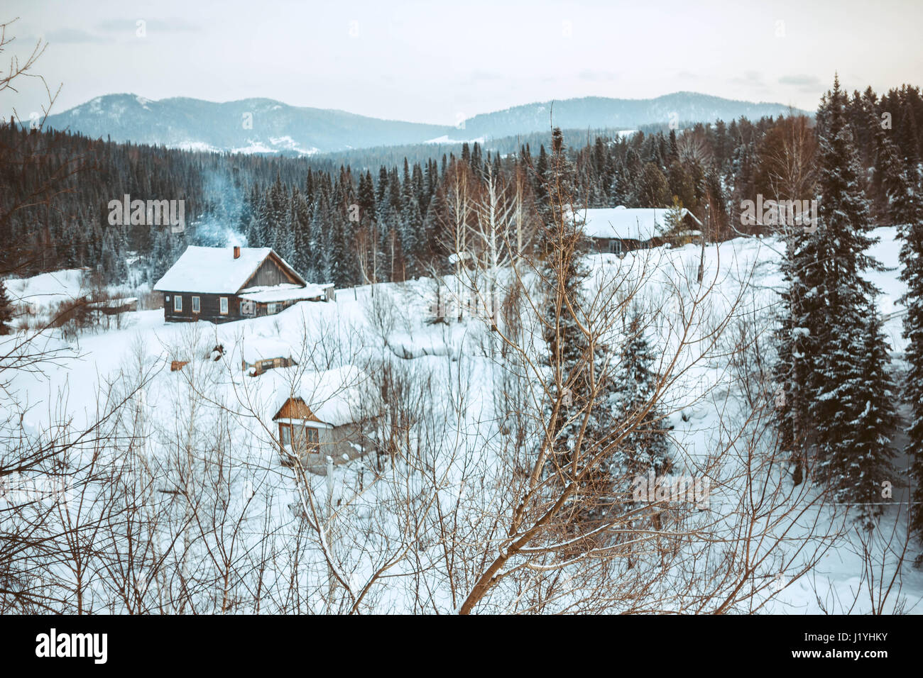 Russian landscape. Snow-covered houses and mountains. Russia Stock ...