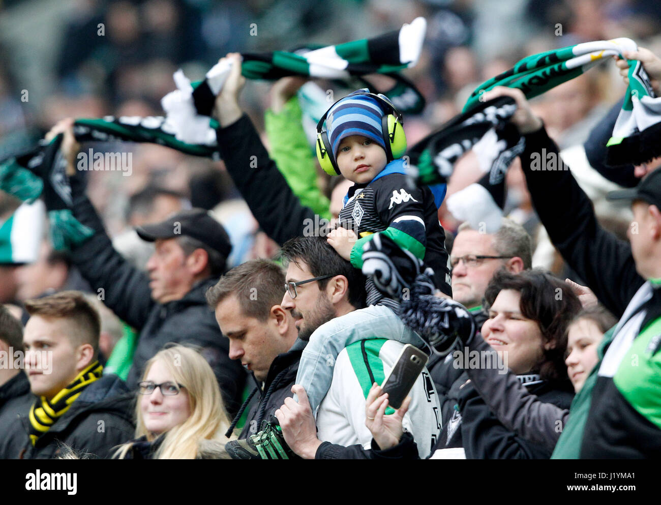 Moenchengladbach, Germany. 22nd Apr, 2017. A young fan wearing ear ...