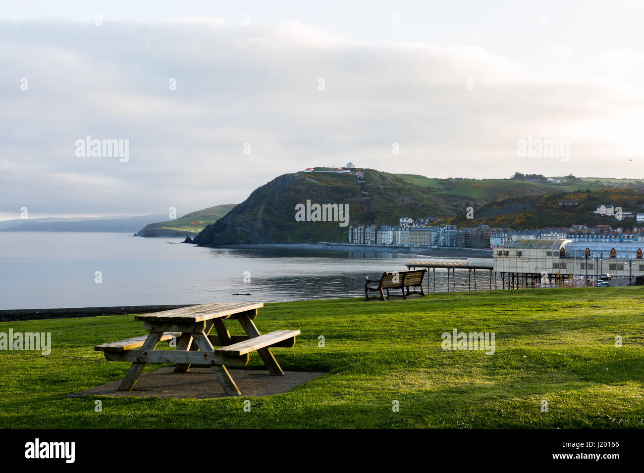 An picnic bench overlooking Aberystwyth. Credit: Ian Jones/Alamy Live ...