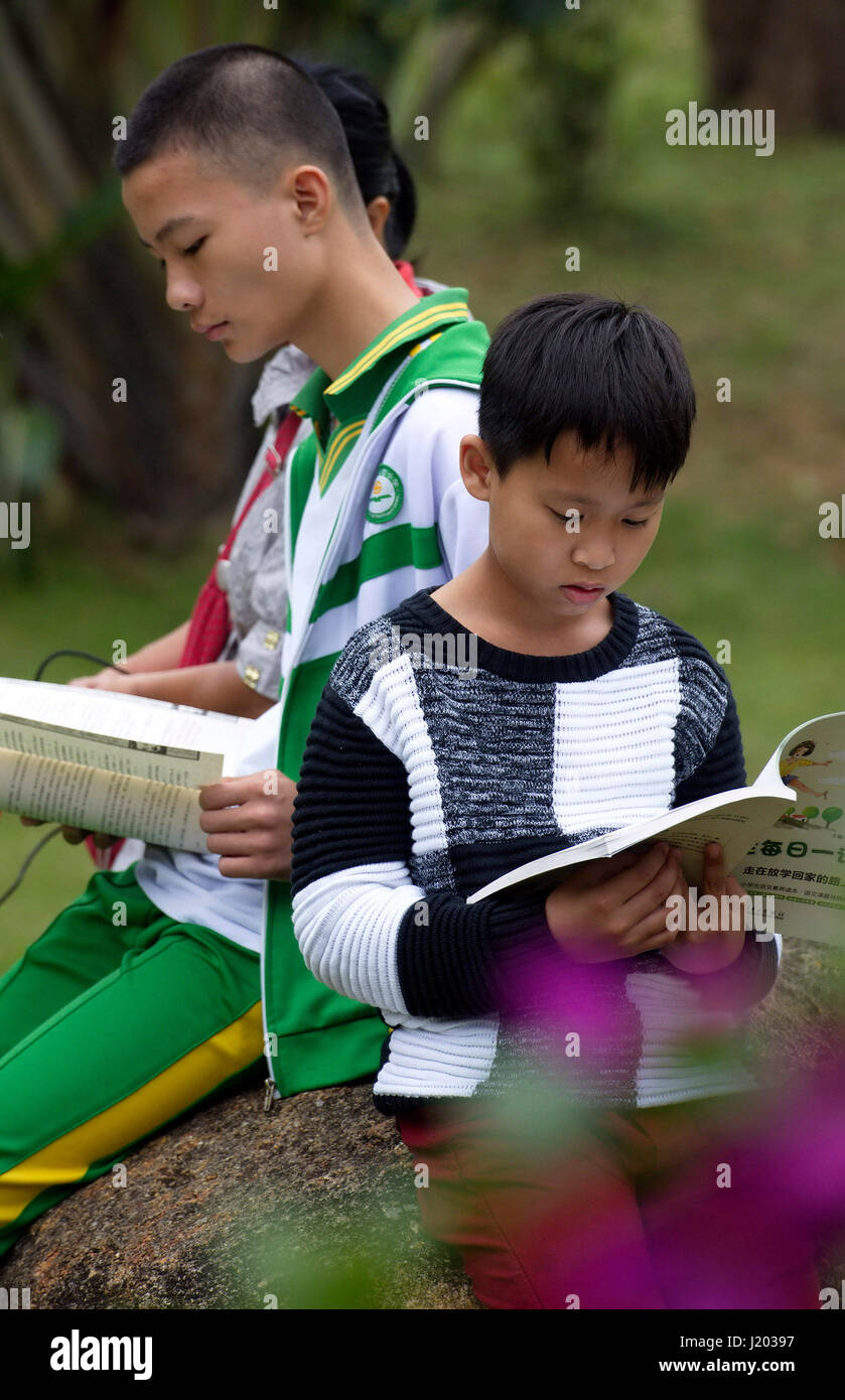 Qionghai, China's Hainan Province. 23rd Apr, 2017. Students read books ...