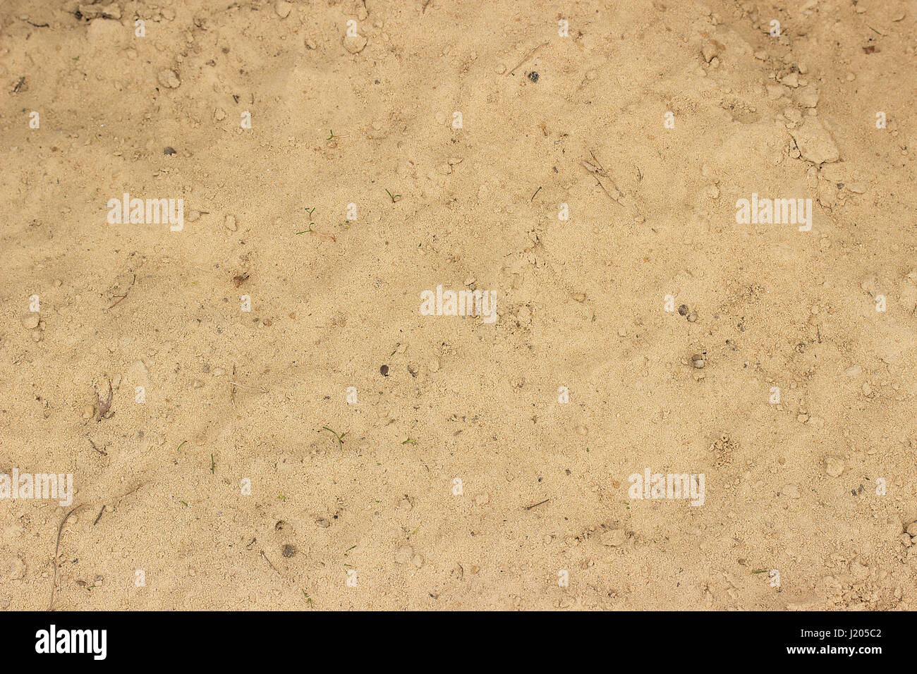 Yellow sand with garbage background or texture Stock Photo - Alamy