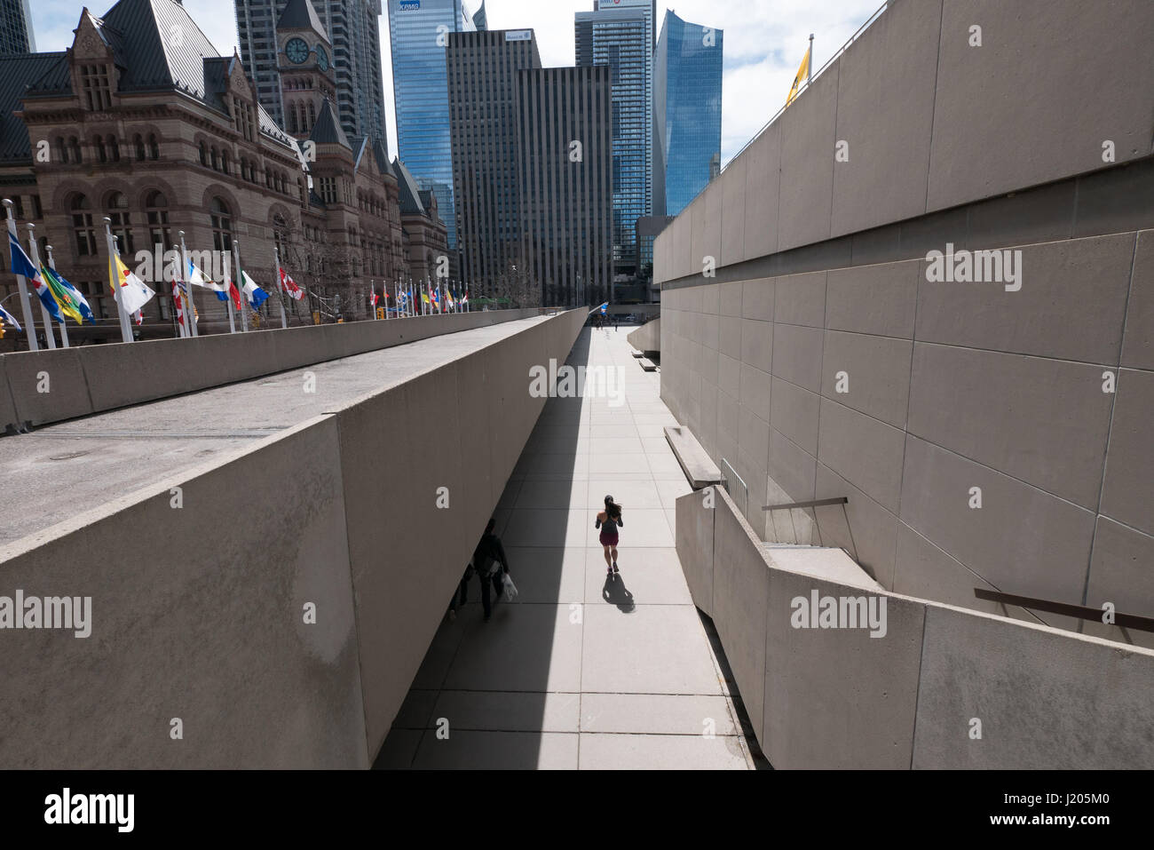 a person running around city hall in toronto canada Stock Photo - Alamy