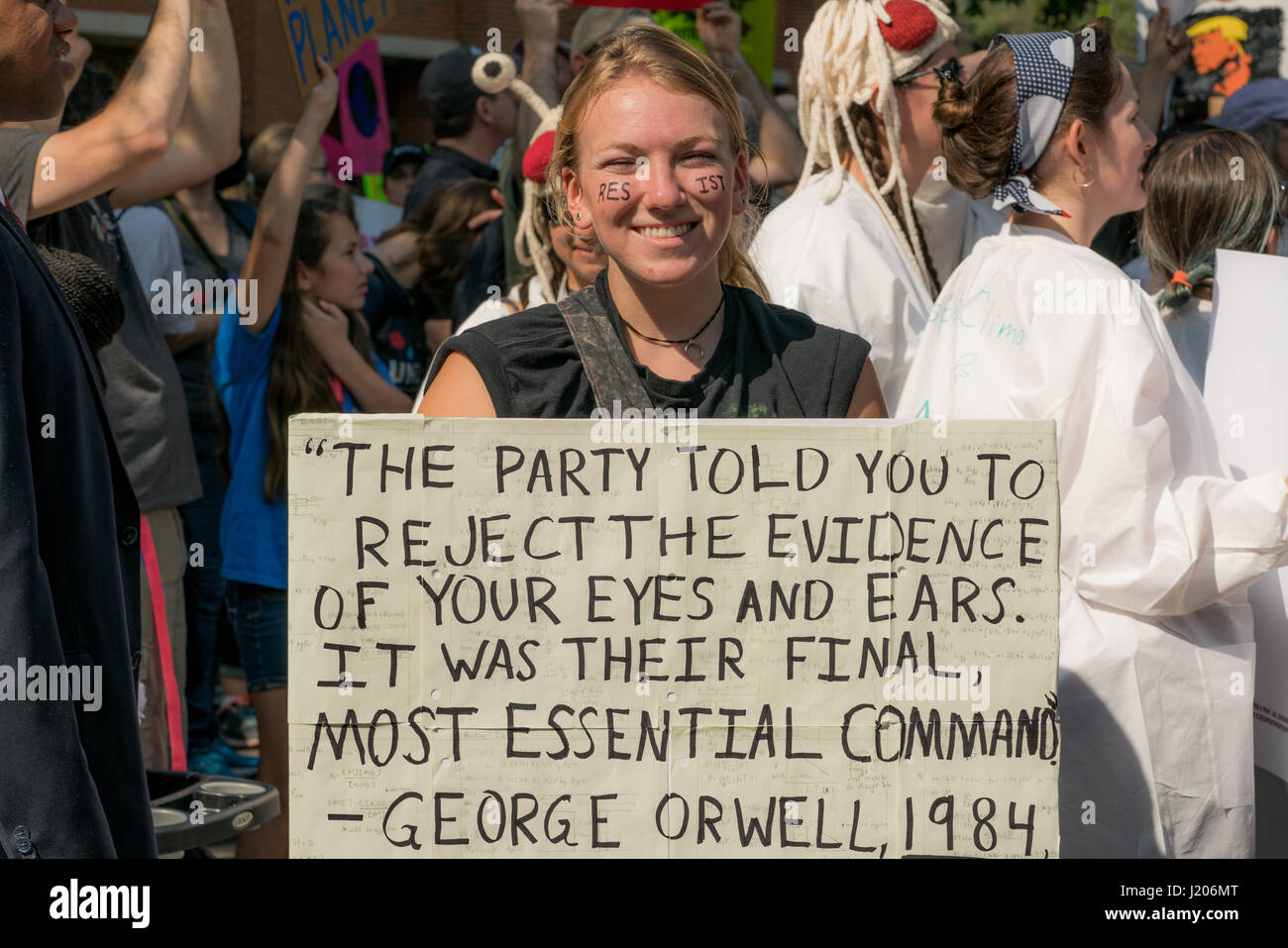 This sign was made with the protester's old homework paper covered in ...