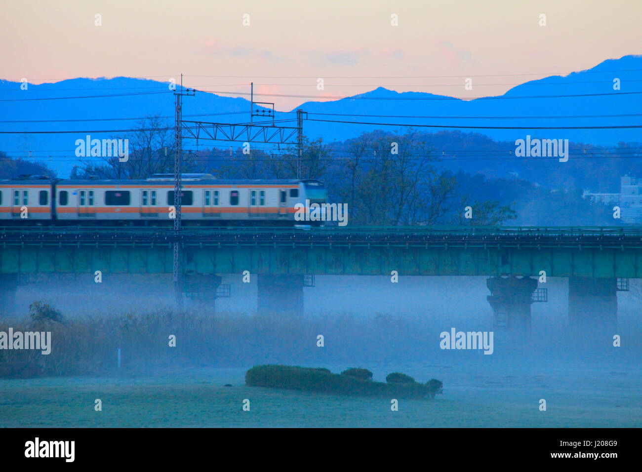 Chuo Line Train on Tama River Tachikawa Tokyo Japan Stock Photo - Alamy