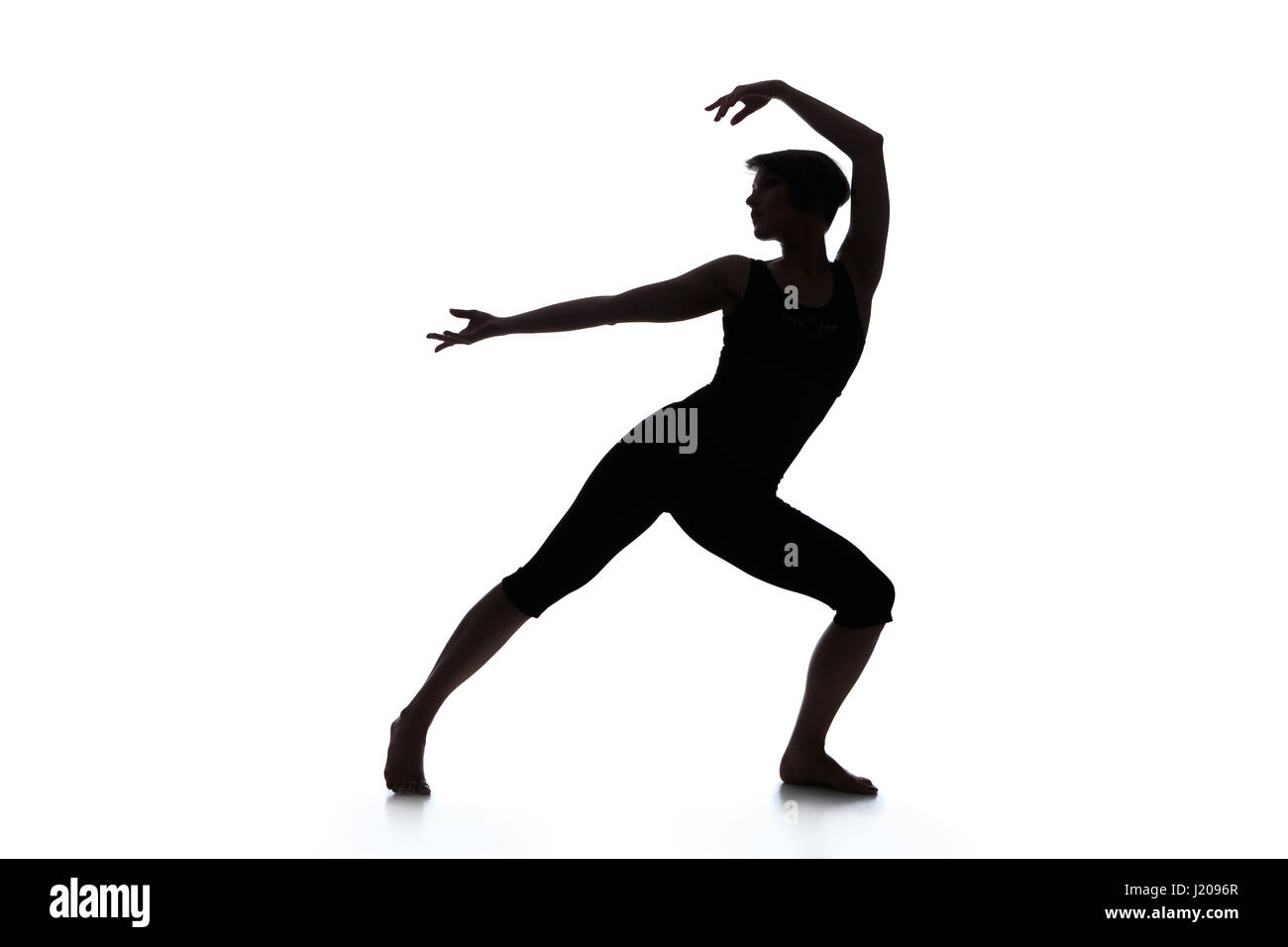 Dancing woman on white background Stock Photo - Alamy