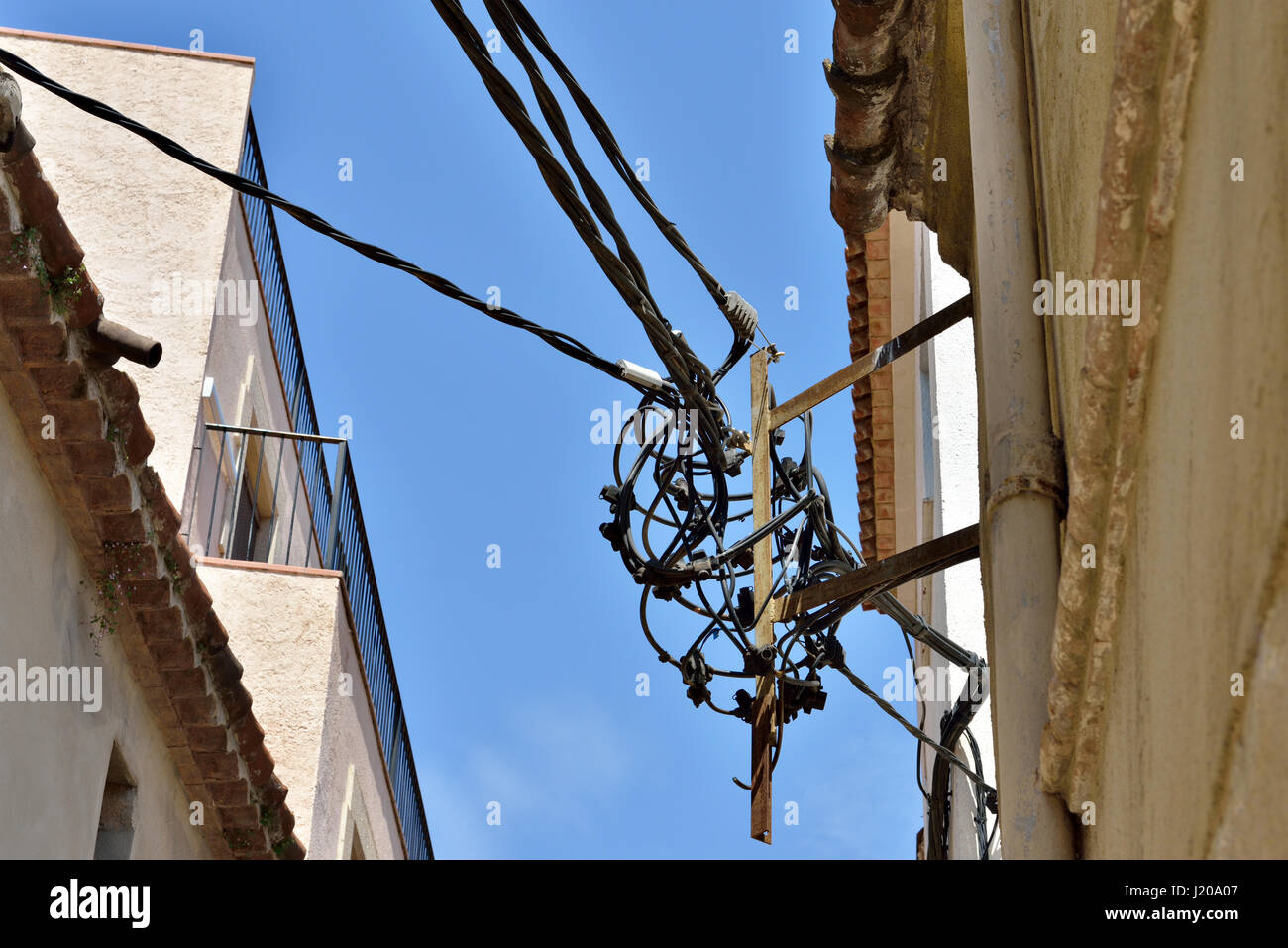 Often seen traditional and old-fashioned street electricity cabling in ...