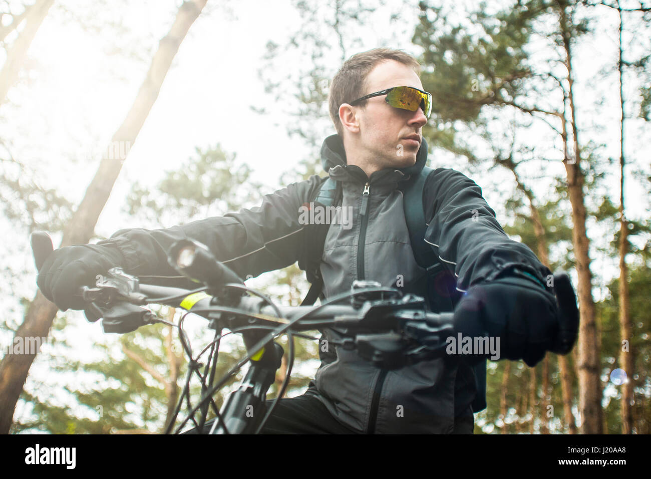Man Rides a Bike in the Forest Stock Photo - Alamy
