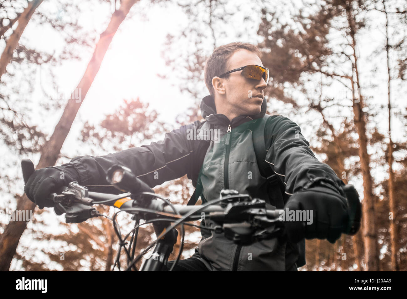 Man Rides a Bike in the Forest Stock Photo - Alamy