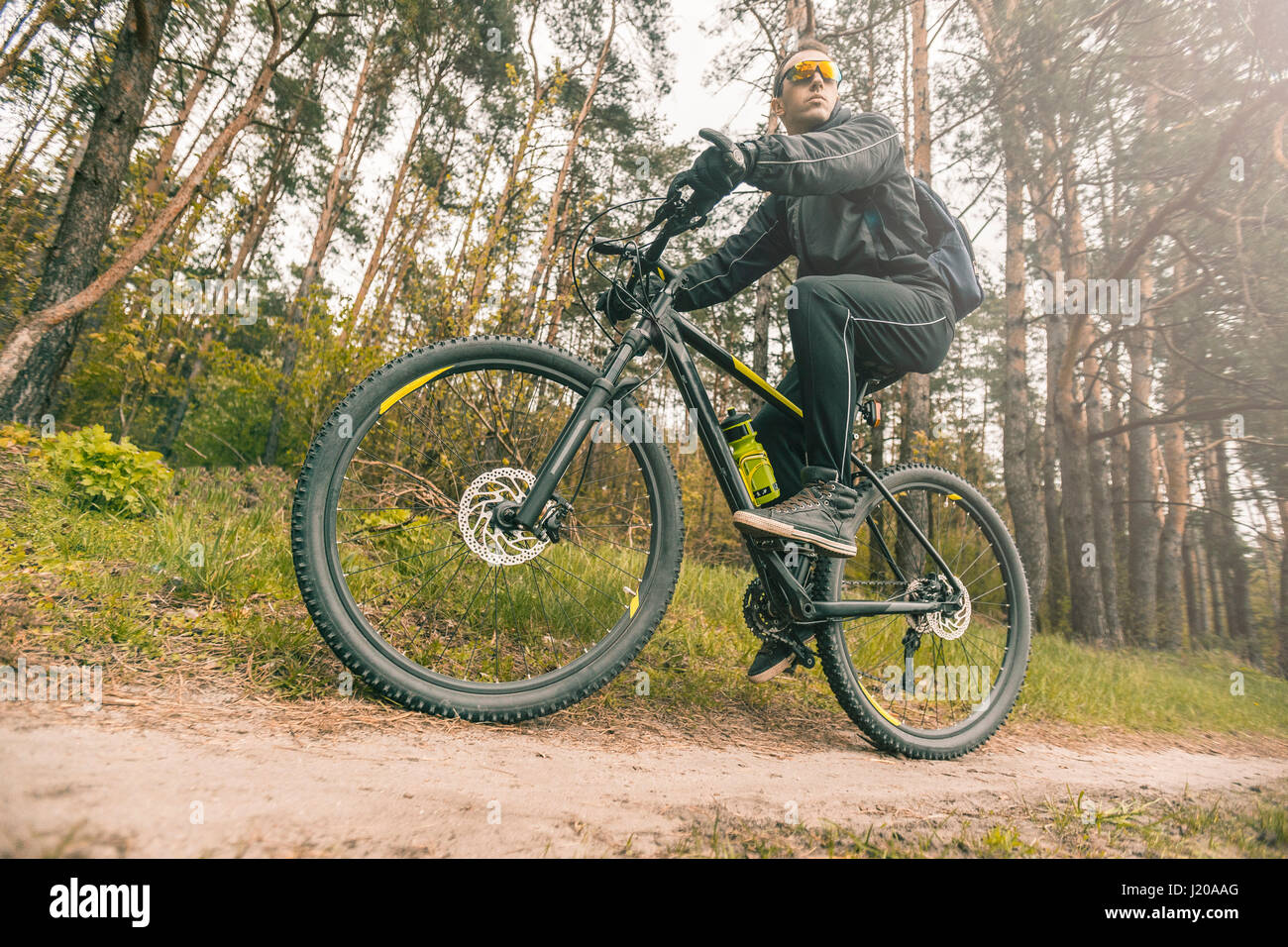 Man Rides a Bike in the Forest Stock Photo - Alamy
