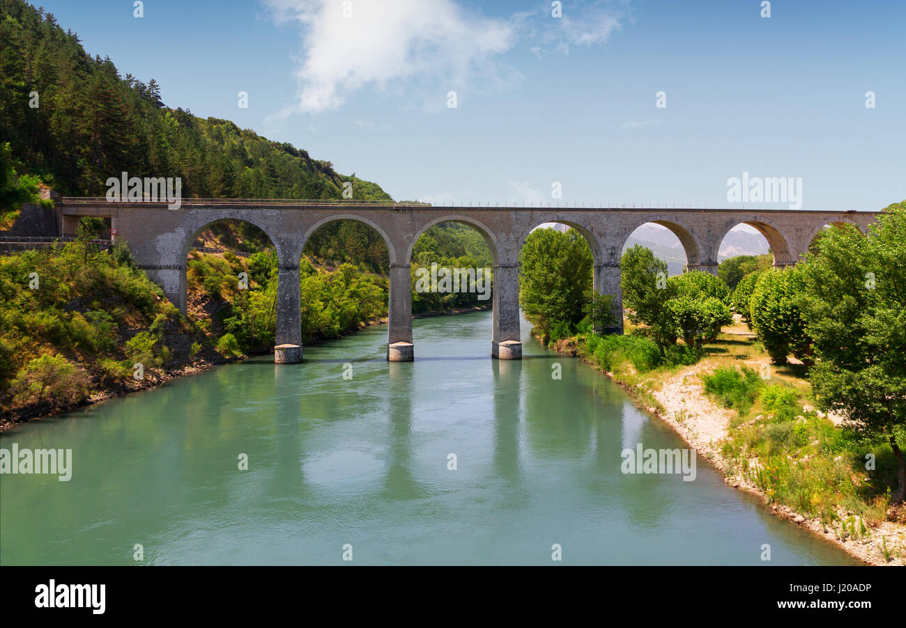Bridge and river in the alps in France Stock Photo - Alamy
