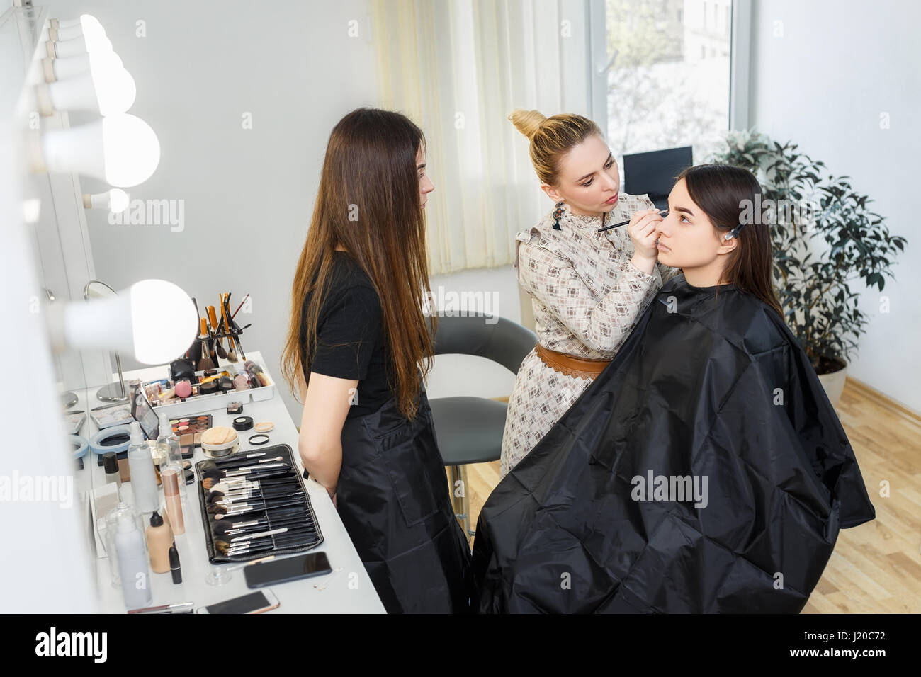 makeup teacher training her student girl to become makeup artist ...