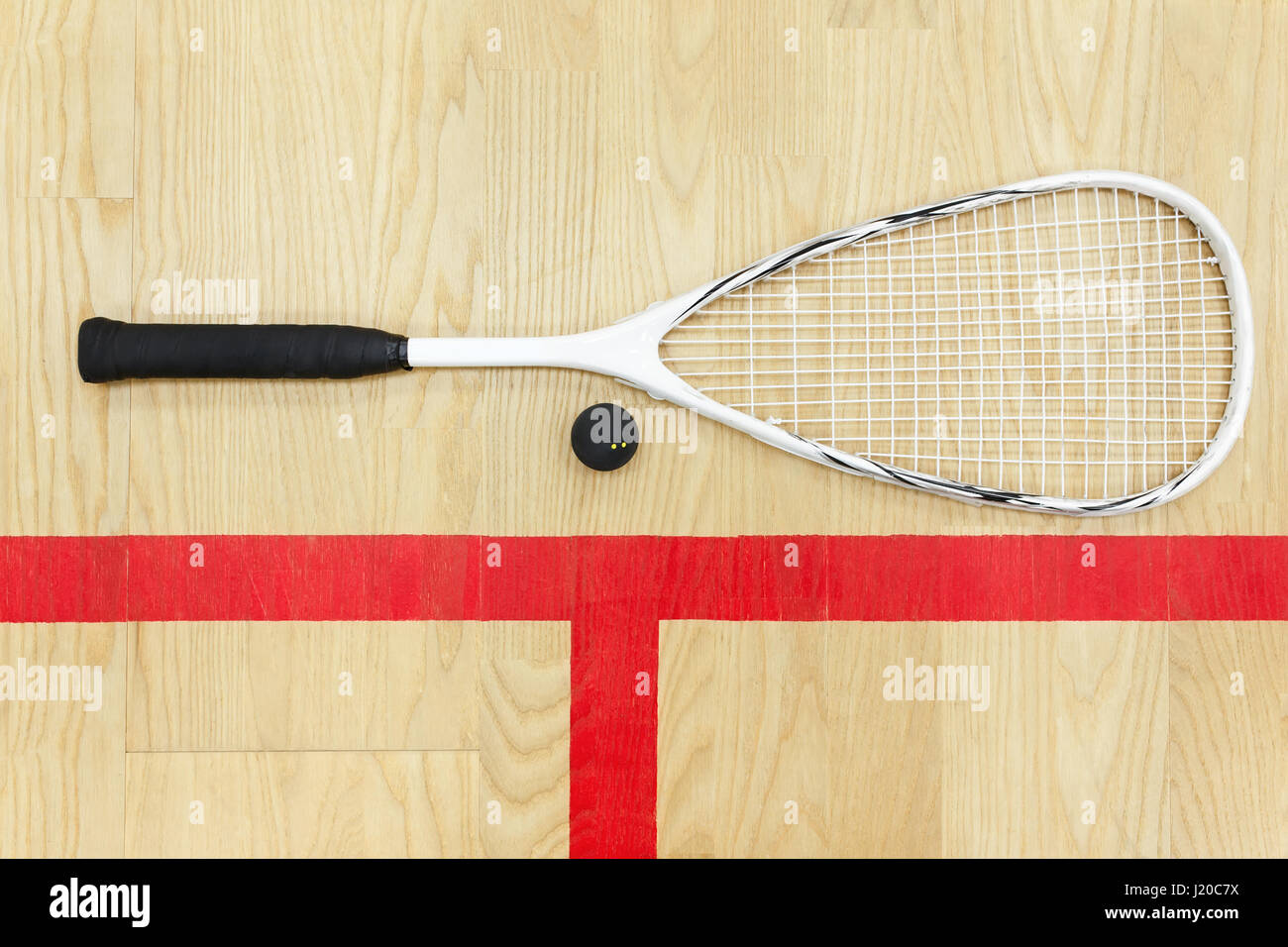 white squash racket and ball on the wooden floor top view. Racquetball ...