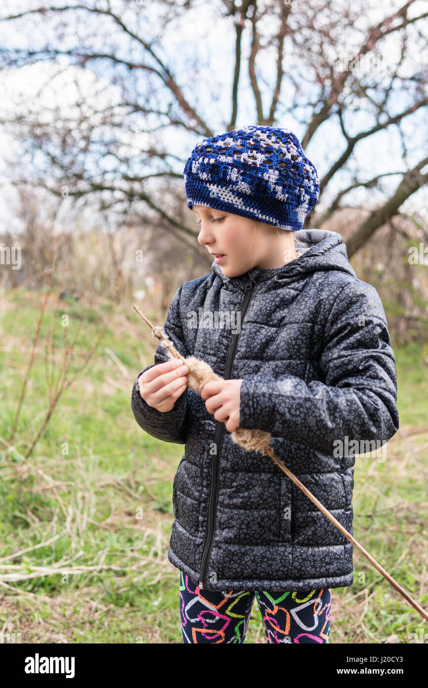 Child pulls out the reed Stock Photo - Alamy