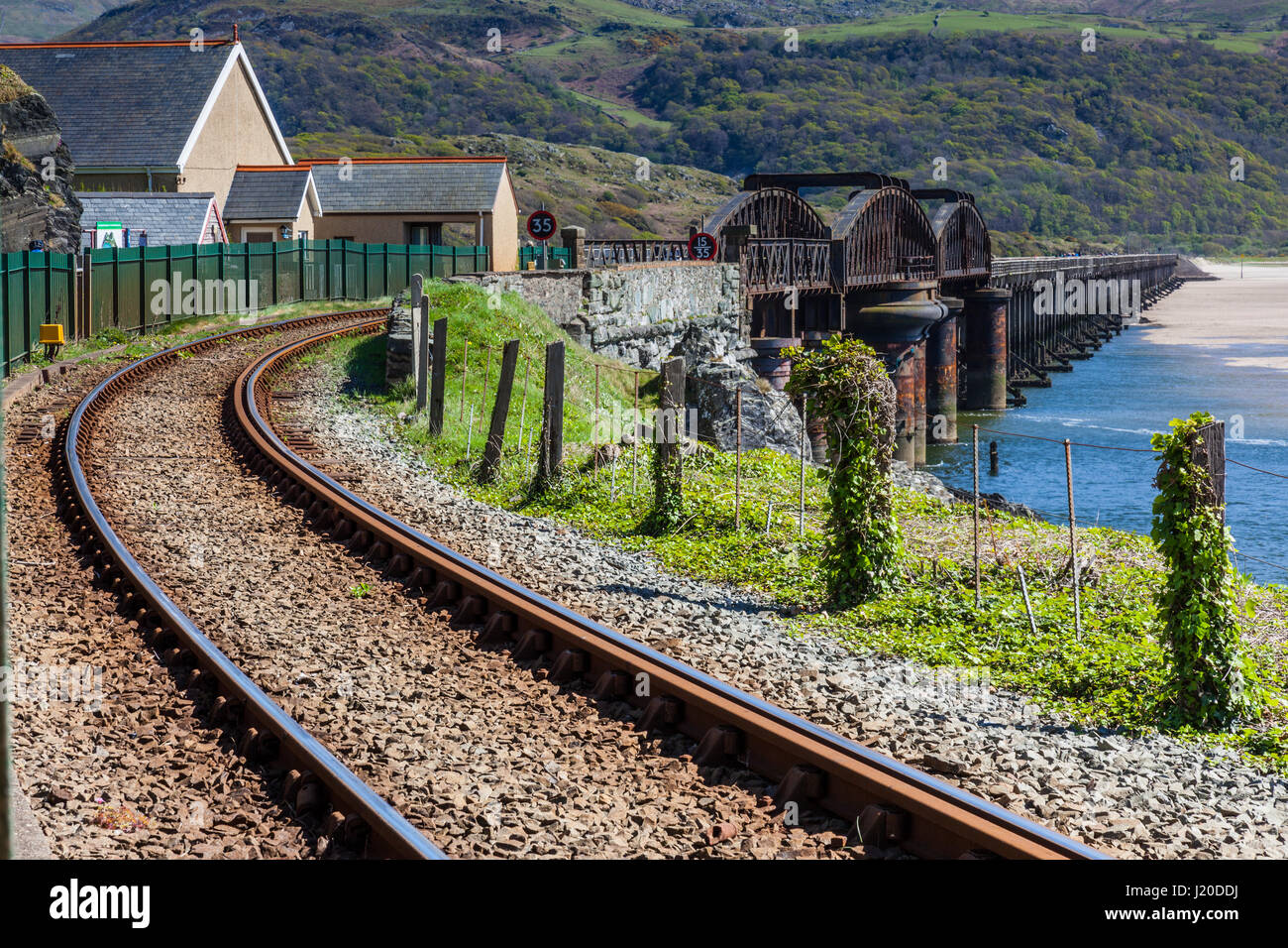 The Cambrian Coast railway line crosses the Mawddach Estuary near ...
