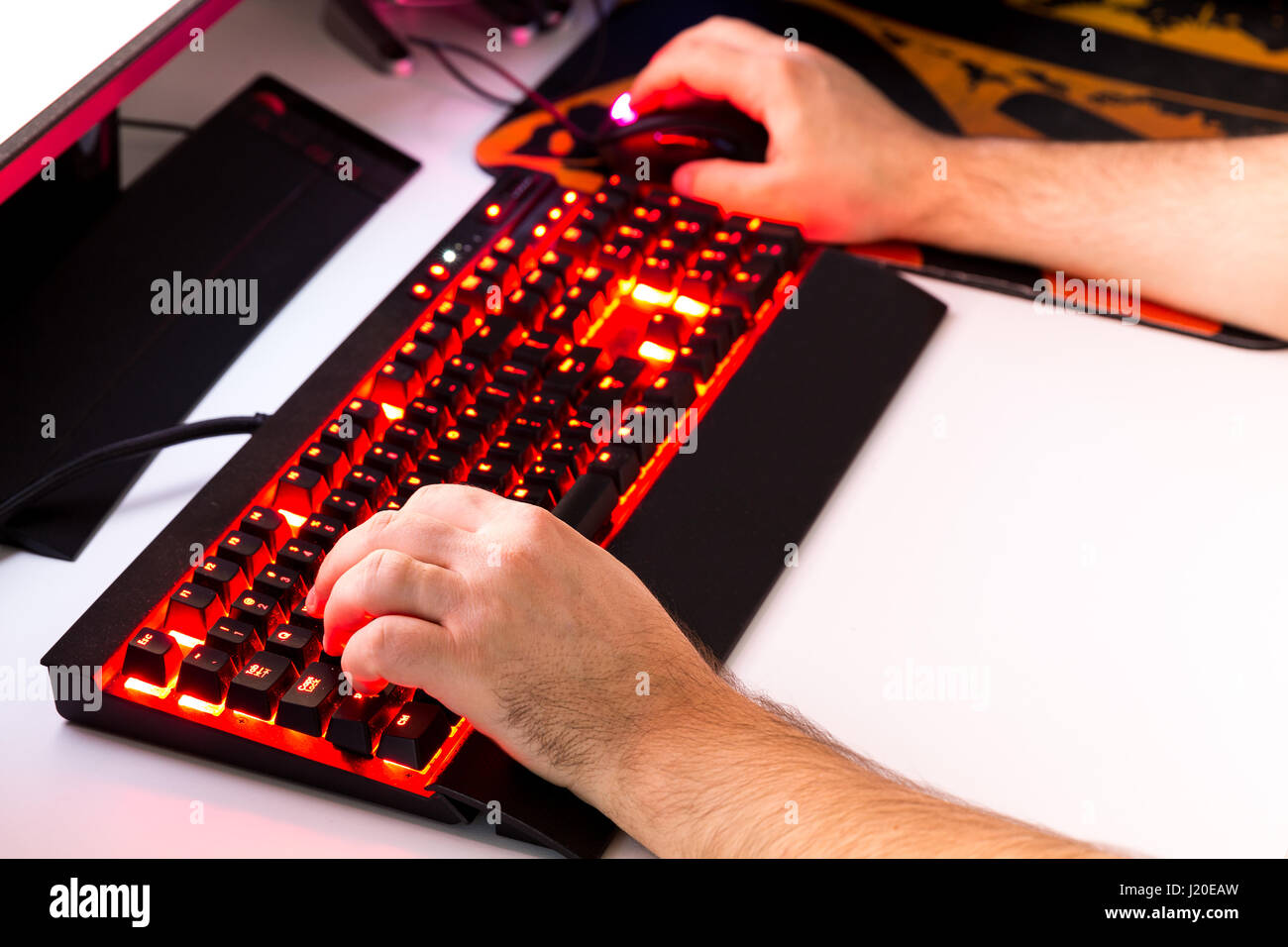 Playing computer game with gaming gear Stock Photo - Alamy