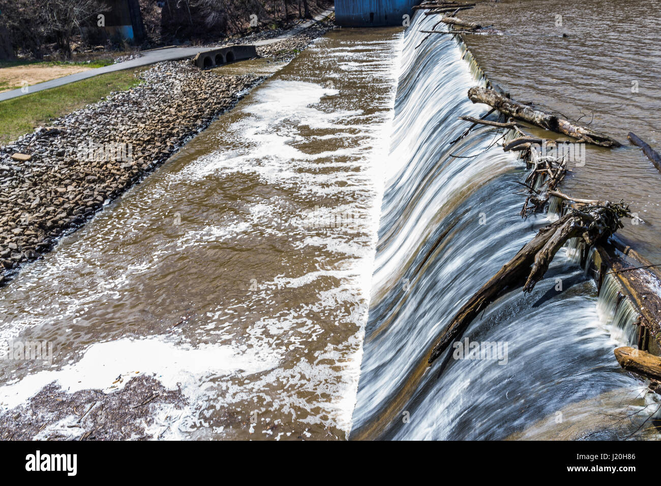 Small dam with running water fall in Accotink park in Fairfax, Virginia ...