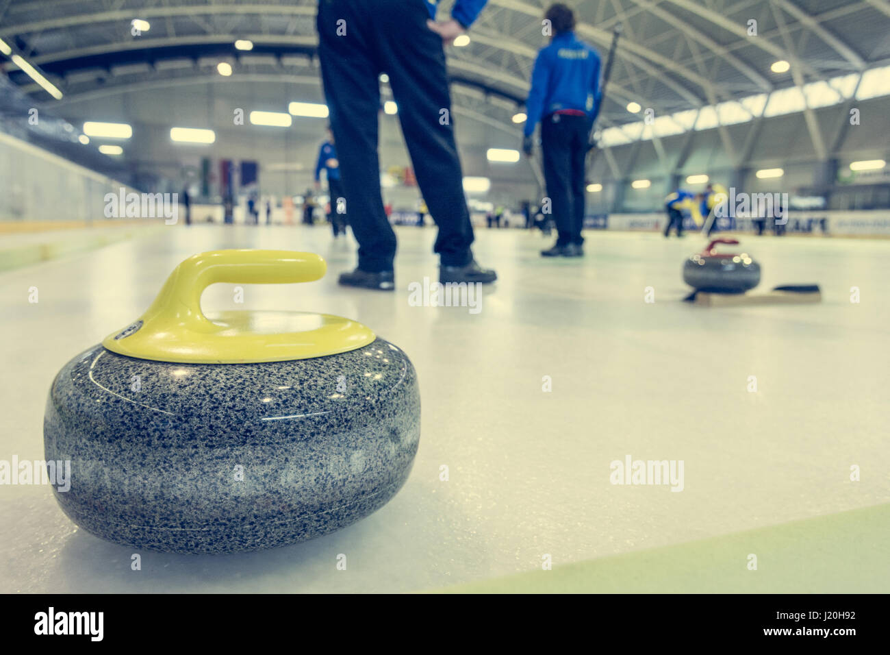 Curling stone on a game sheet. Indoor sport on ice Stock Photo - Alamy