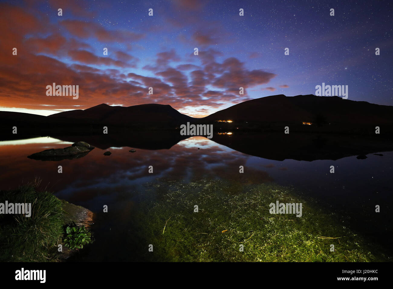 Twighlight reflected in Tewet Tarn with the famous Blencathra mountain ...