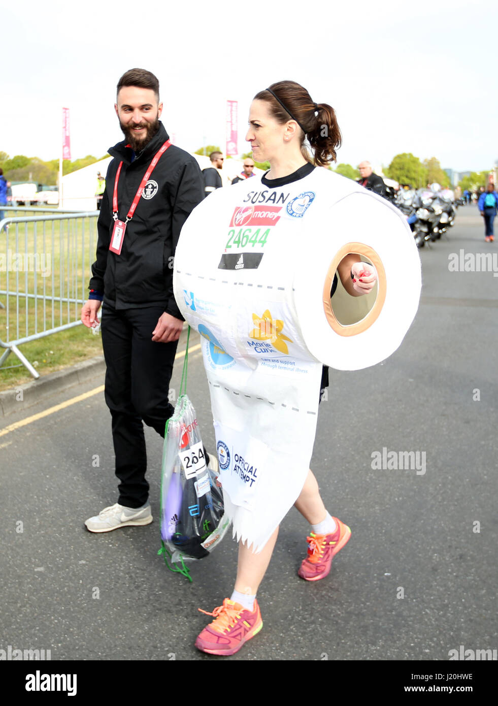 Fancy dress runners head to the start line of the Virgin Money London ...