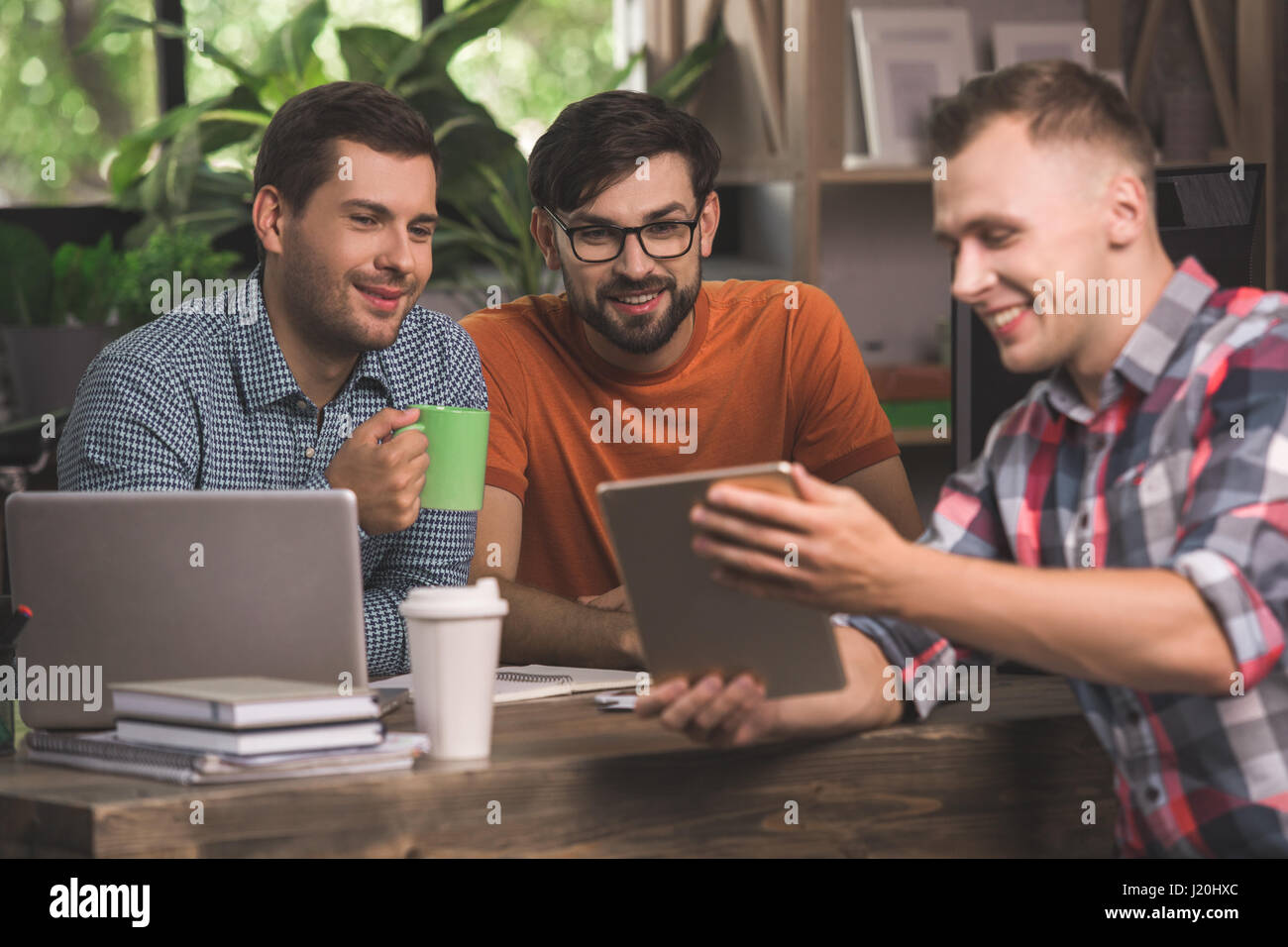 Young men programmers working together in the office Stock Photo - Alamy