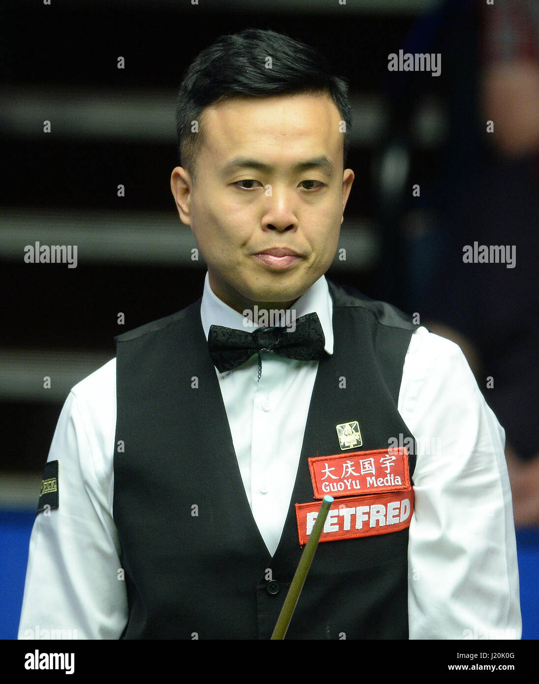 Marco Fu at the table in his match against Neil Robertson on day nine of the Betfred Snooker ...