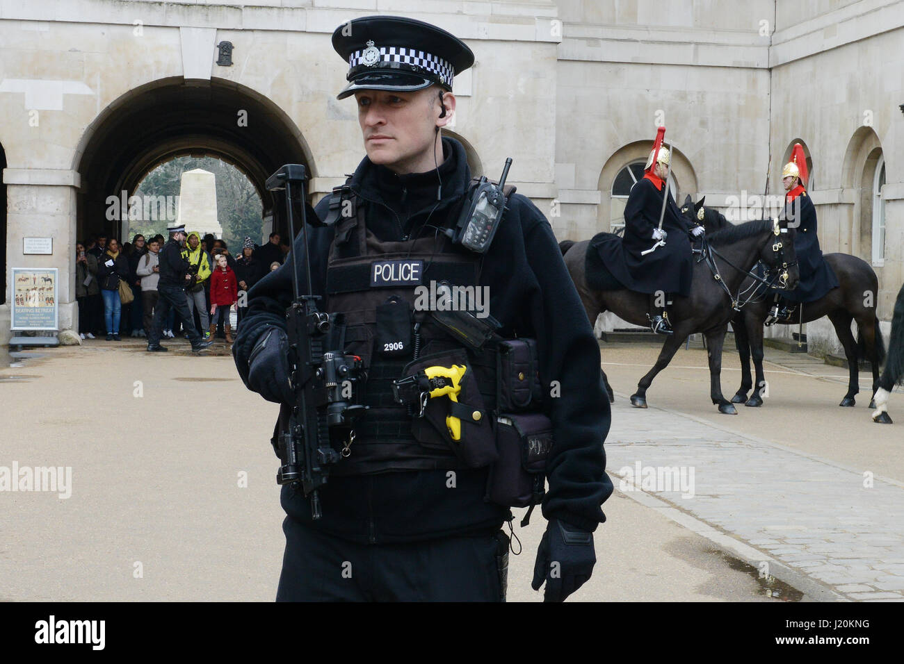 London's armed police patrol changing of the guard on Horse guards ...