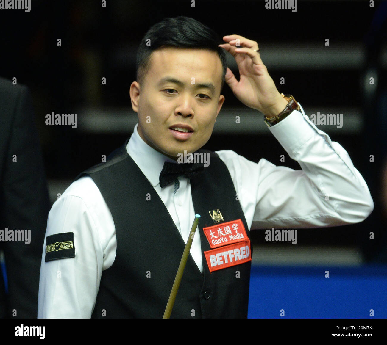 Marco Fu at the table in his match against Neil Robertson on day nine ...