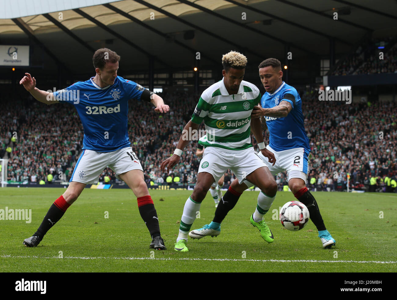 Celtic's Scott Sinclair (centre) challenges Rangers' Andrew Halliday ...