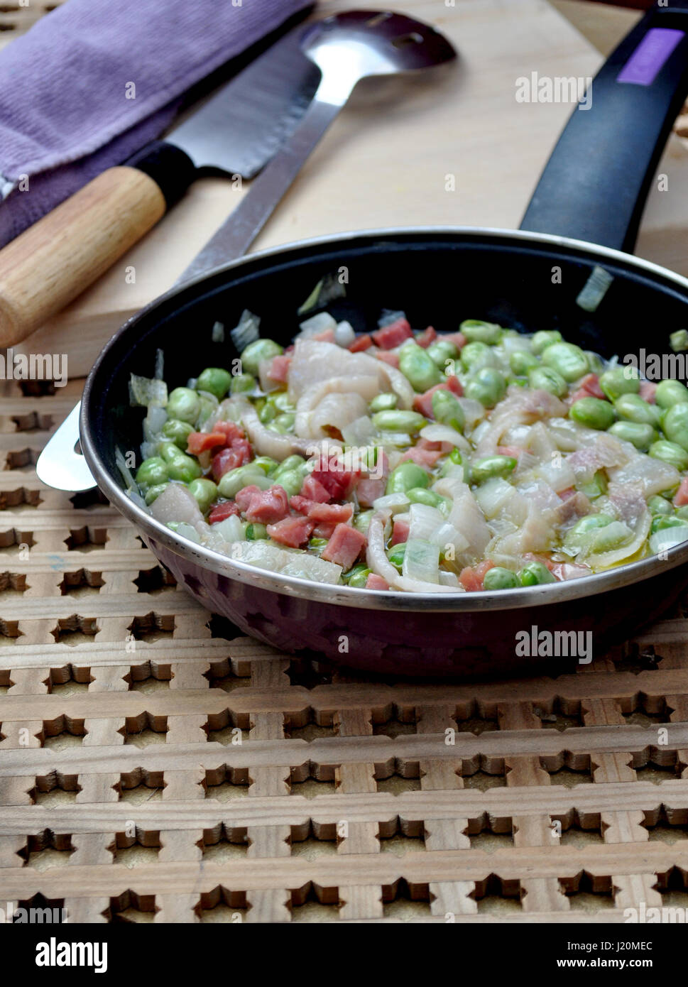 frying pan with broad beans cooking with ham Stock Photo - Alamy