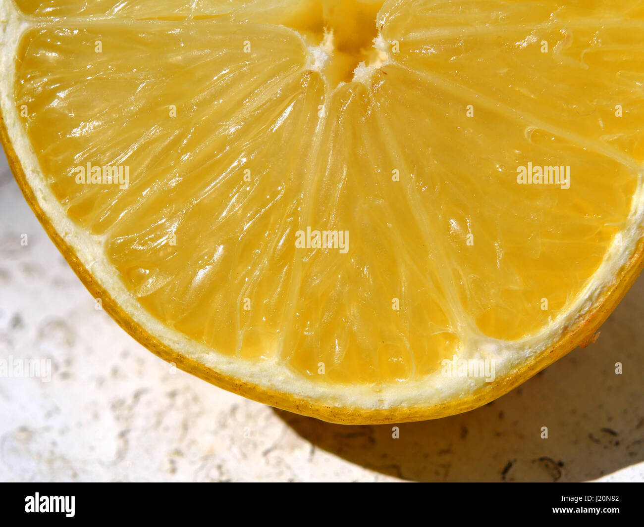 A close-up of cut lemon in the sunshine Stock Photo - Alamy