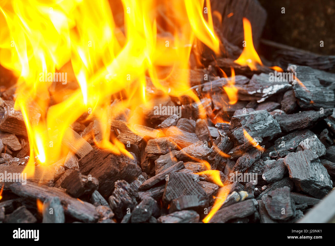 Close up of camp fire flames and fire burning charcoal in the ...