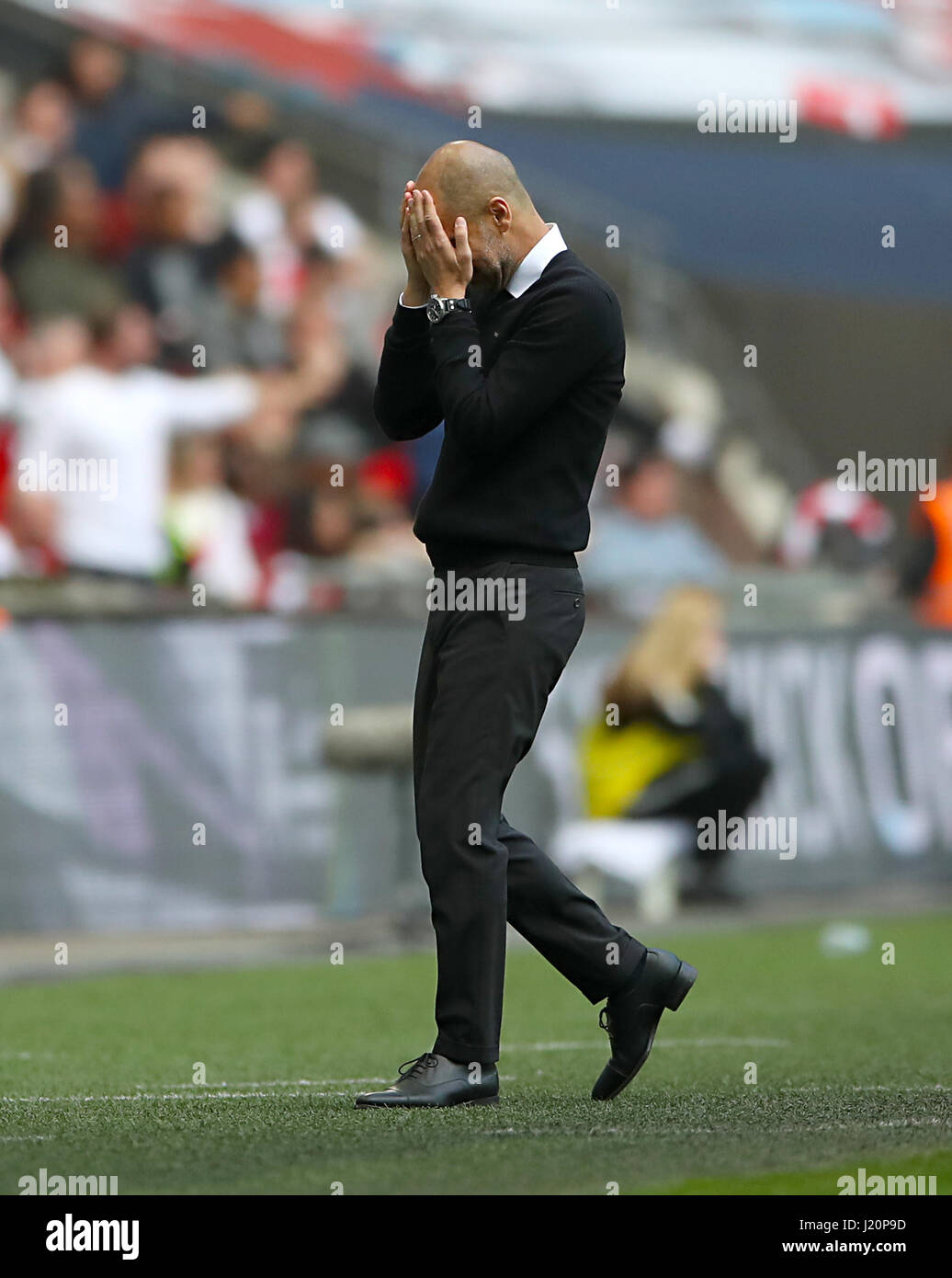 Pep guardiola manchester city reacts hi-res stock photography and ...