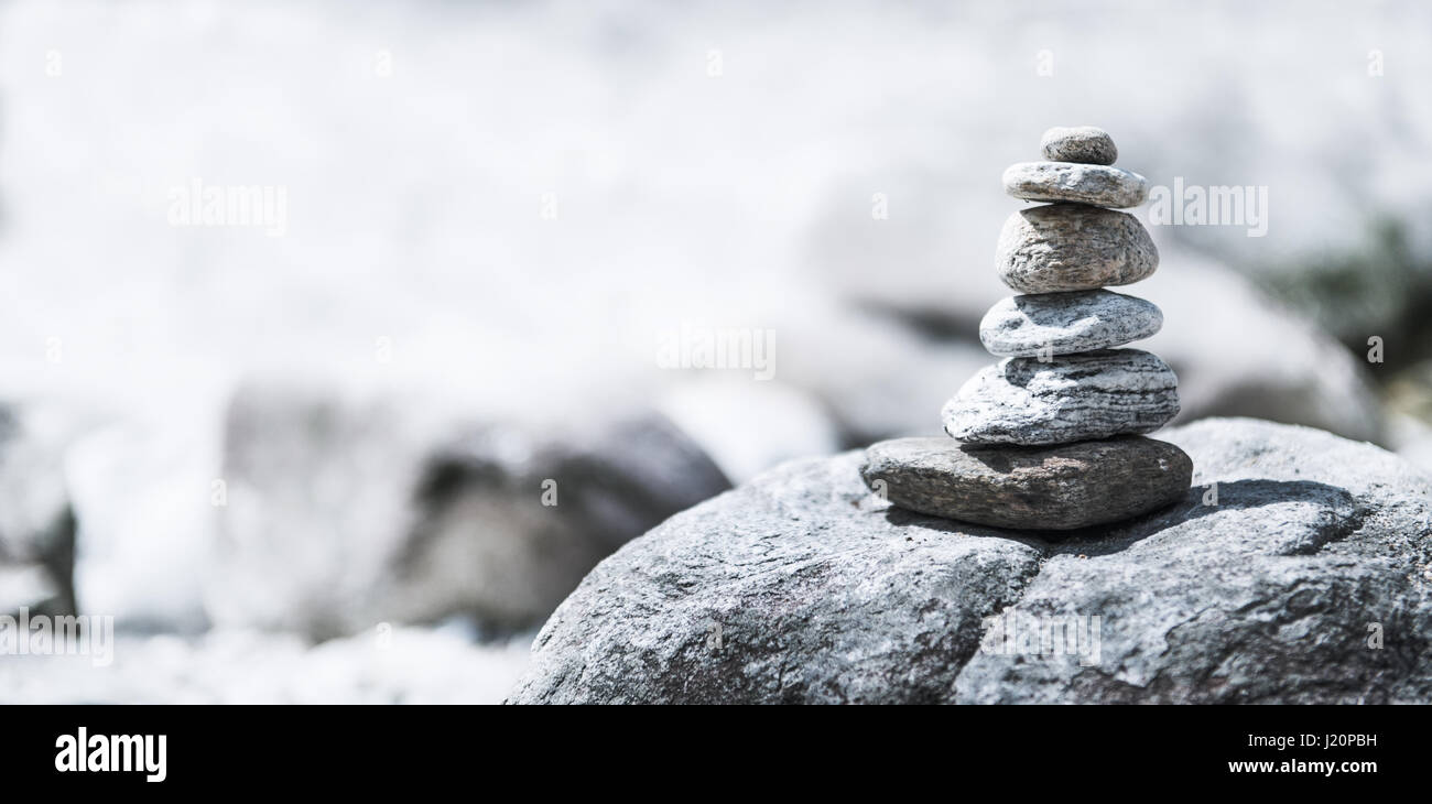 grey Zen Stones stacked beside a river Stock Photo - Alamy