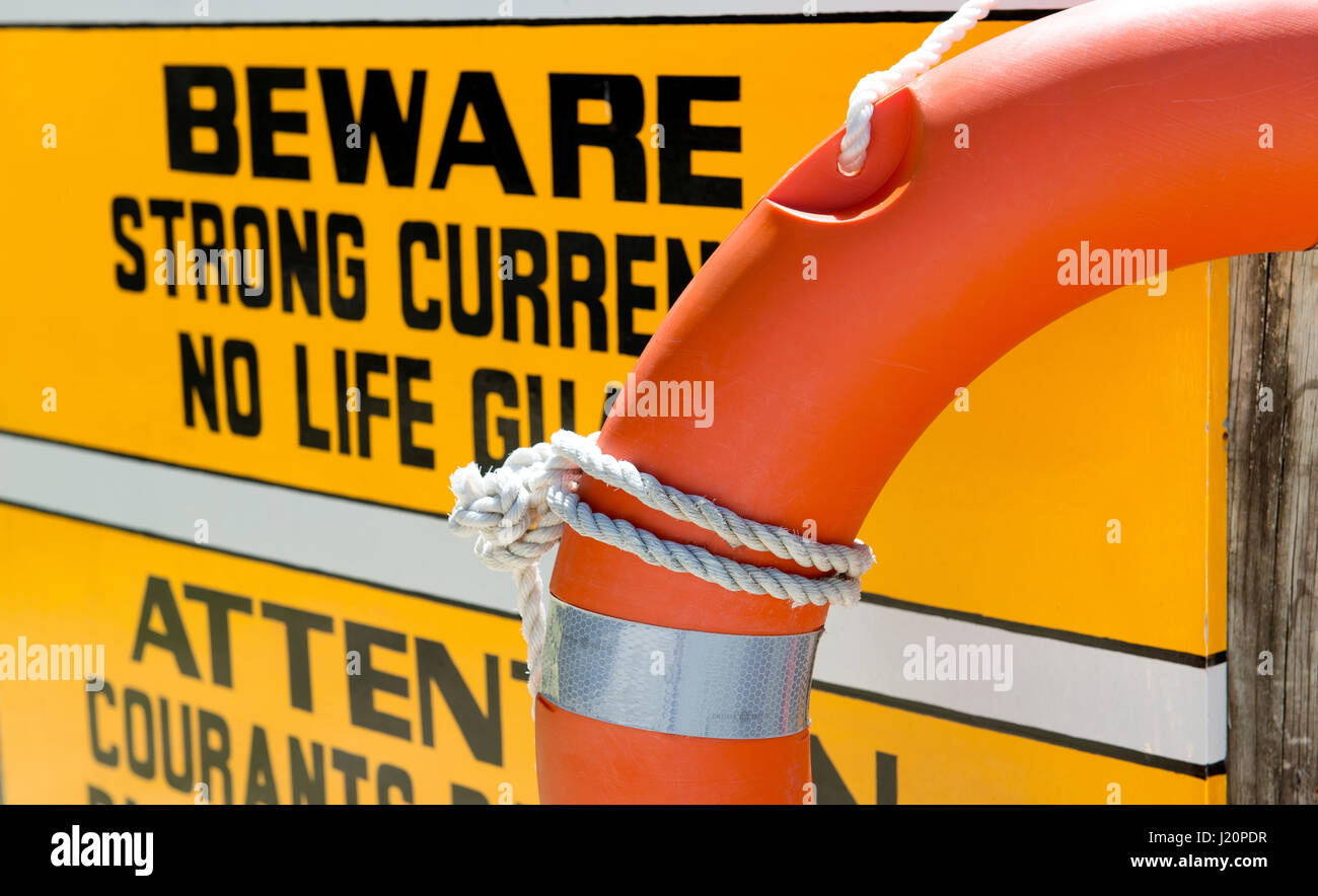 Warning Sign with lifebuoy Stock Photo - Alamy