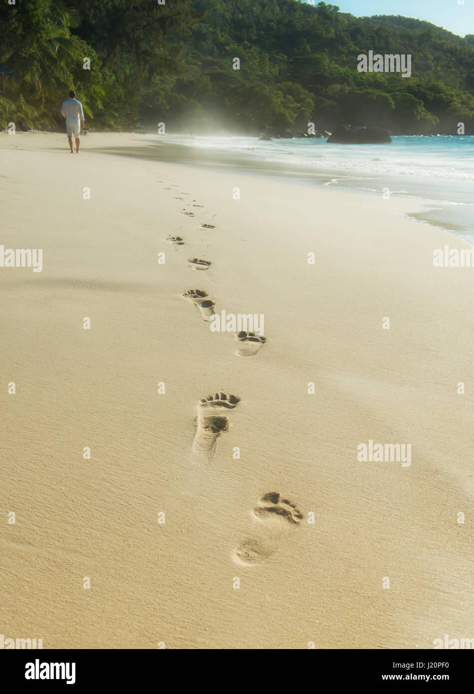 Footsteps in the sand Stock Photo - Alamy