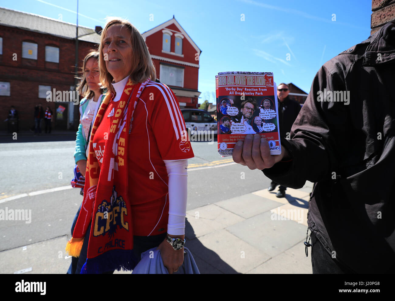 Fans arrive outside Anfield, Liverpool Stock Photo - Alamy