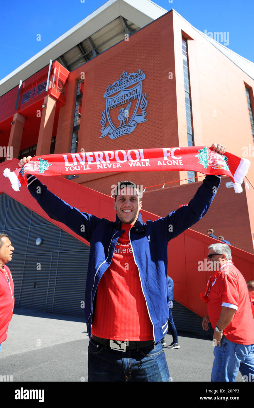 A Liverpool fan outside the ground before the Premier League match at ...
