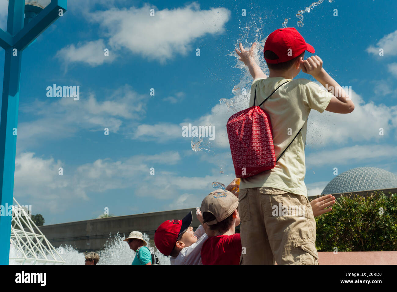 Boys having fun at the dancing water in Epcot Stock Photo - Alamy