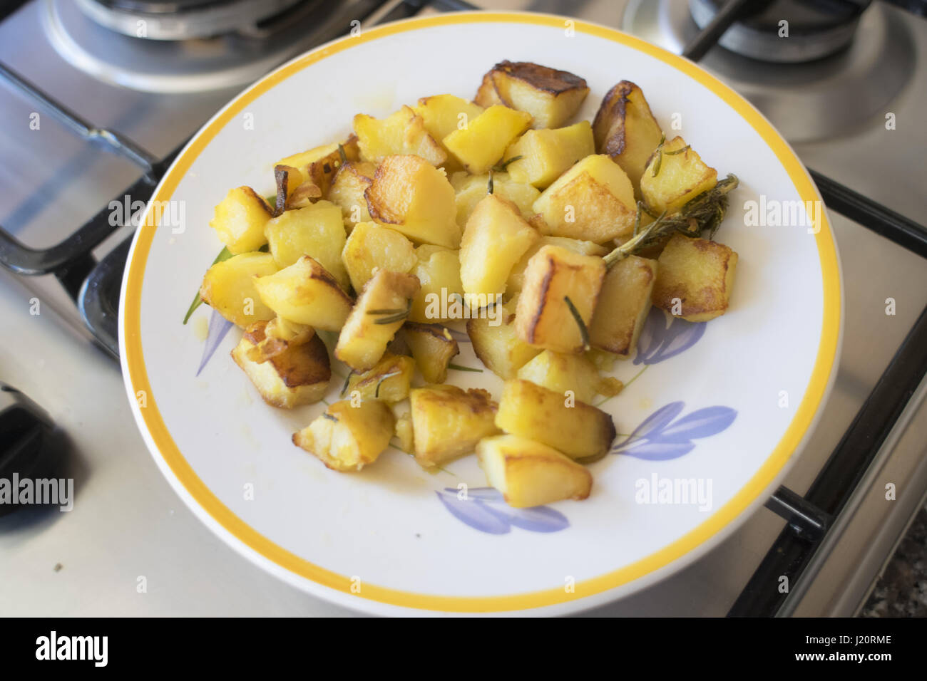 roast potatoes cut in cubes and seasoned with herbs Stock Photo - Alamy