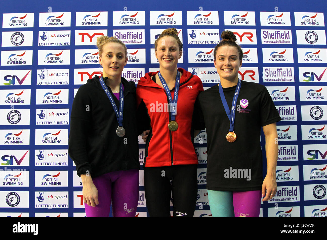 Sarah Vasey (centre) poses with her gold medal after winning the Women ...
