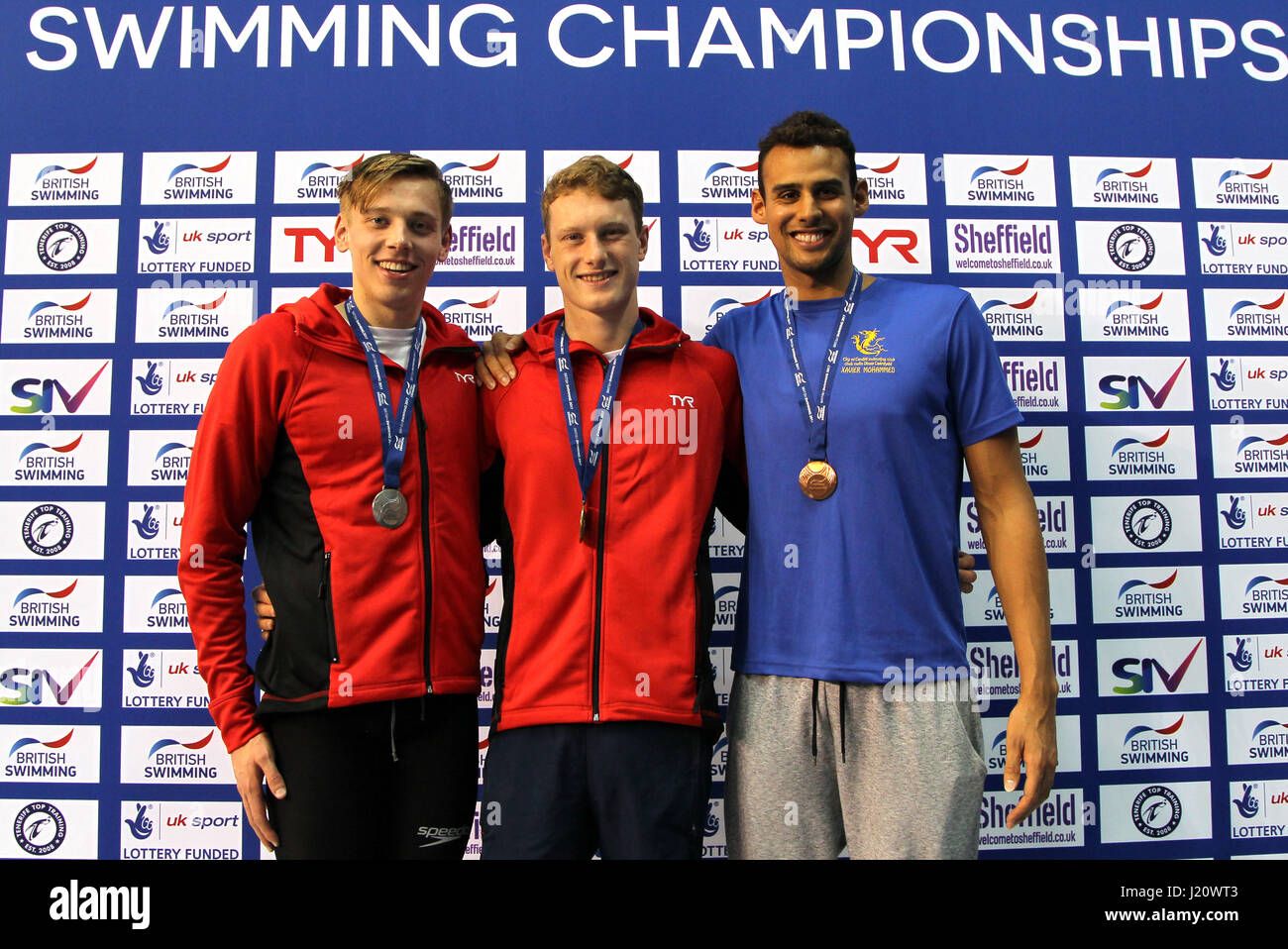 Luke Greenbank (centre) poses with his gold medal after winning The Men ...