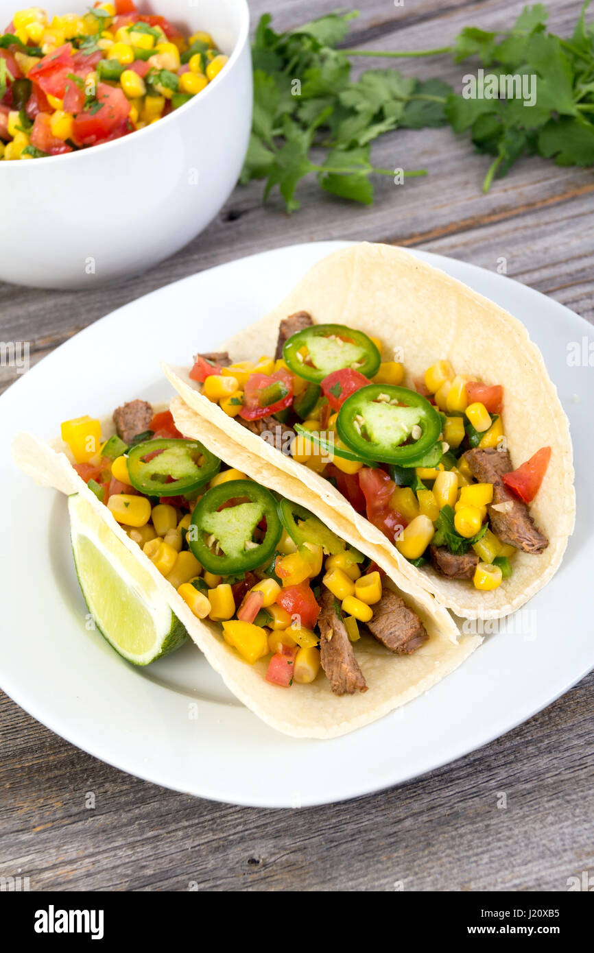 beef corn soft taco on rustic wood table with corn salsa Stock Photo ...