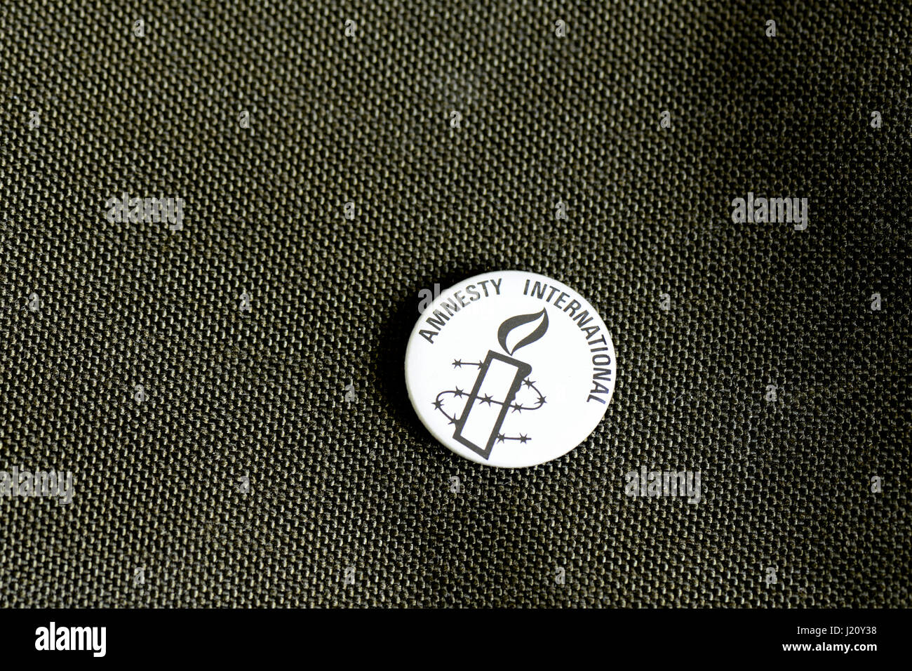 Amnesty International Badge Stock Photo - Alamy
