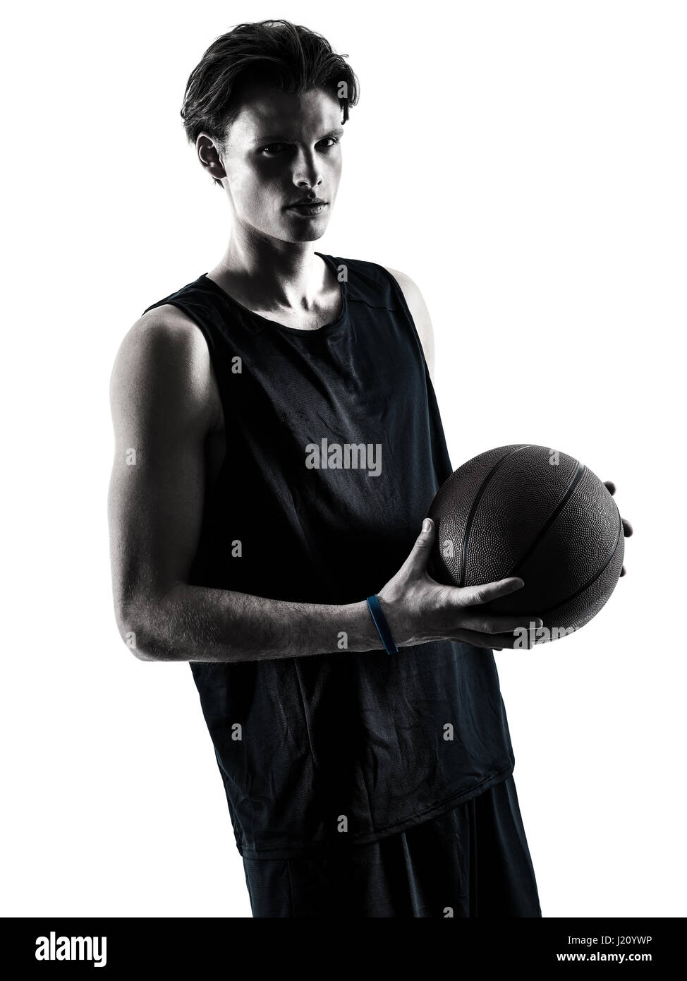 one caucasian basketball player man isolated in silhouette shadow on ...