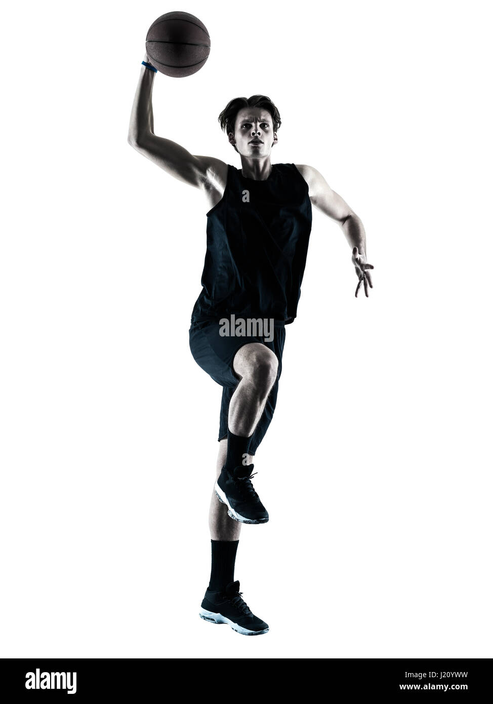 one caucasian basketball player man isolated in silhouette shadow on ...