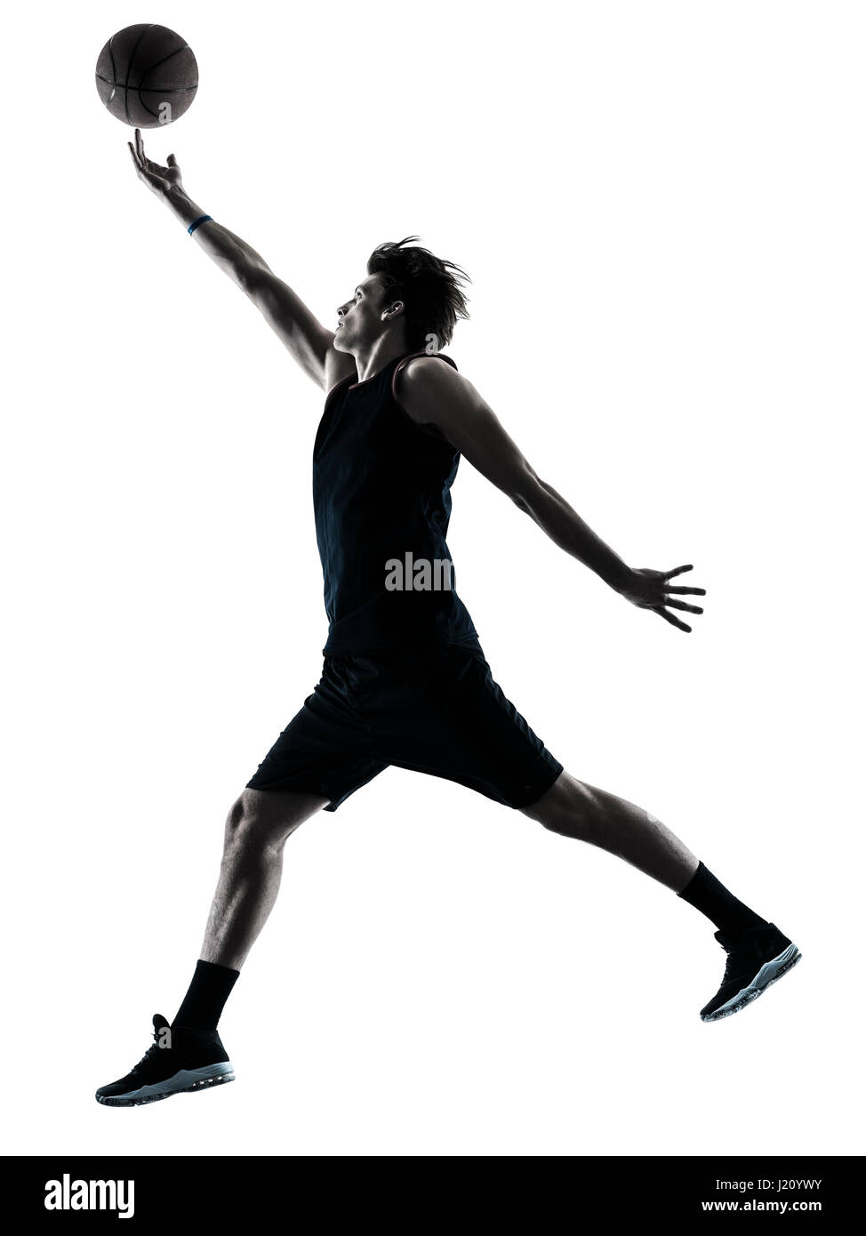 one caucasian basketball player man isolated in silhouette shadow on ...